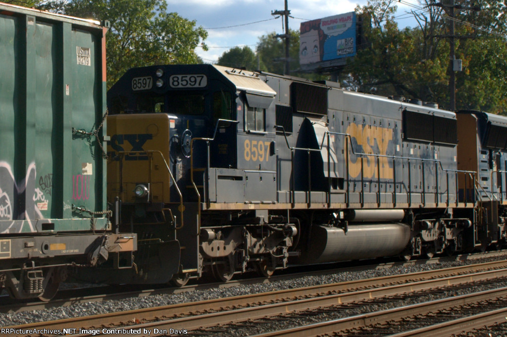 CSX SD50-2 8597 trails on Q703